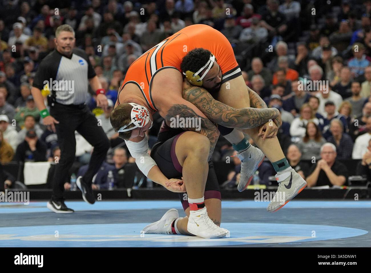 Oklahoma State's Wyatt Hendrickson, top, takes on Minnesota's Gable ...