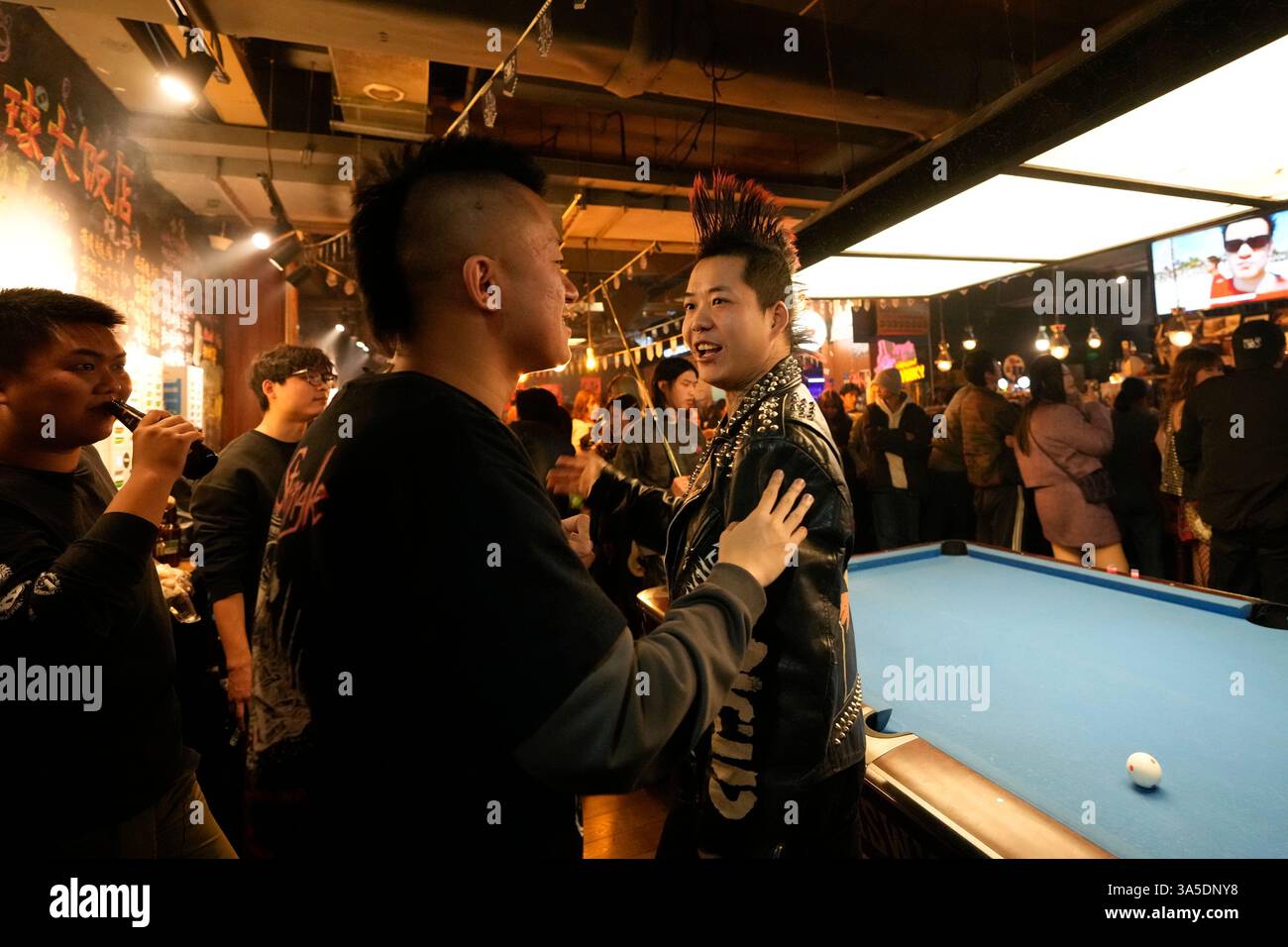 Chinese punks talk at a bar during a punk festival in Hangzhou, China ...