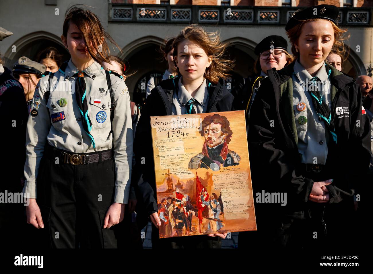 Krakow, Poland. 22nd Mar, 2025. Guides hold a portrait of Tadeusz ...