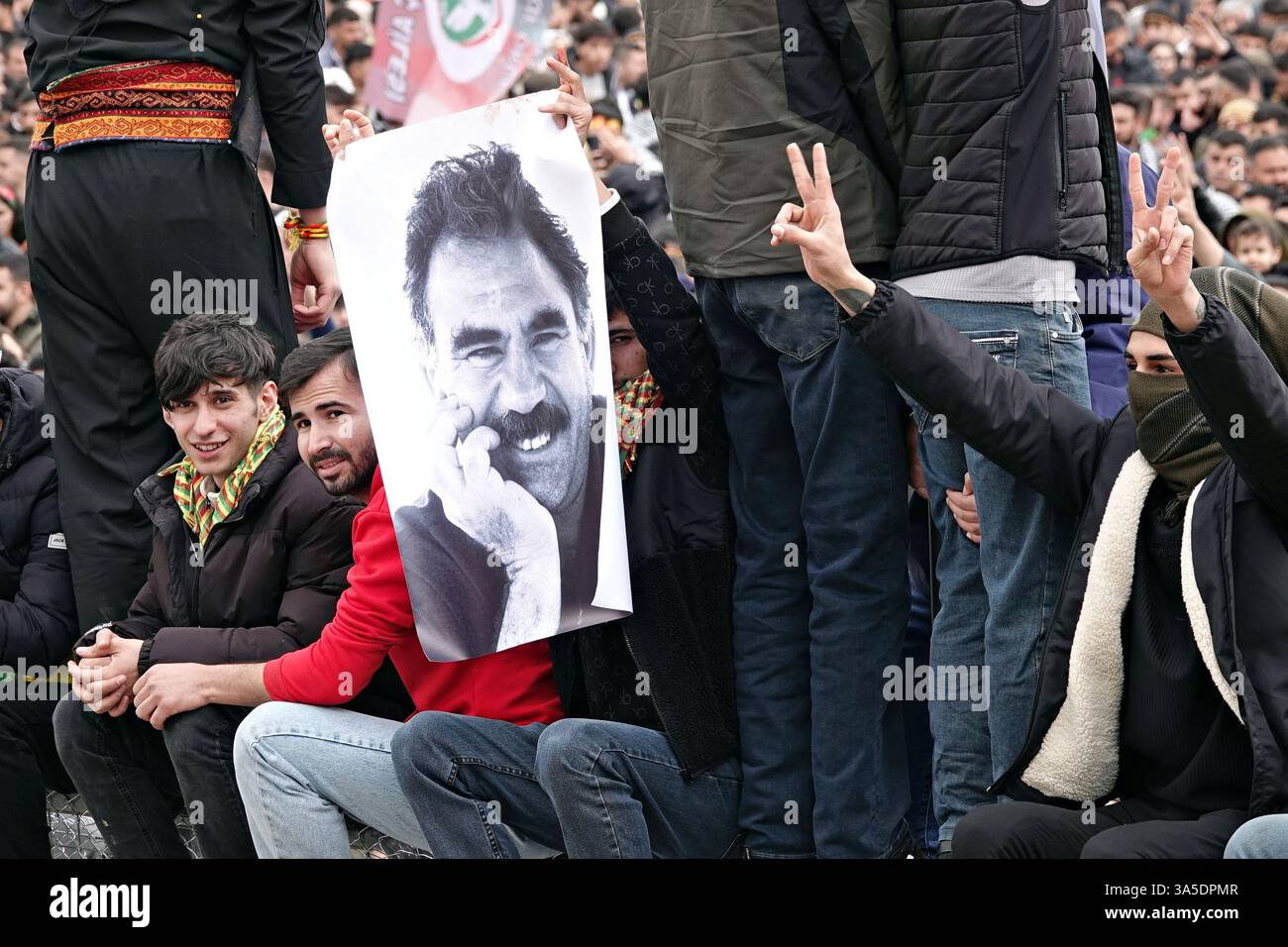 A poster of PKK leader Abdullah Ocalan is seen being carried at the ...