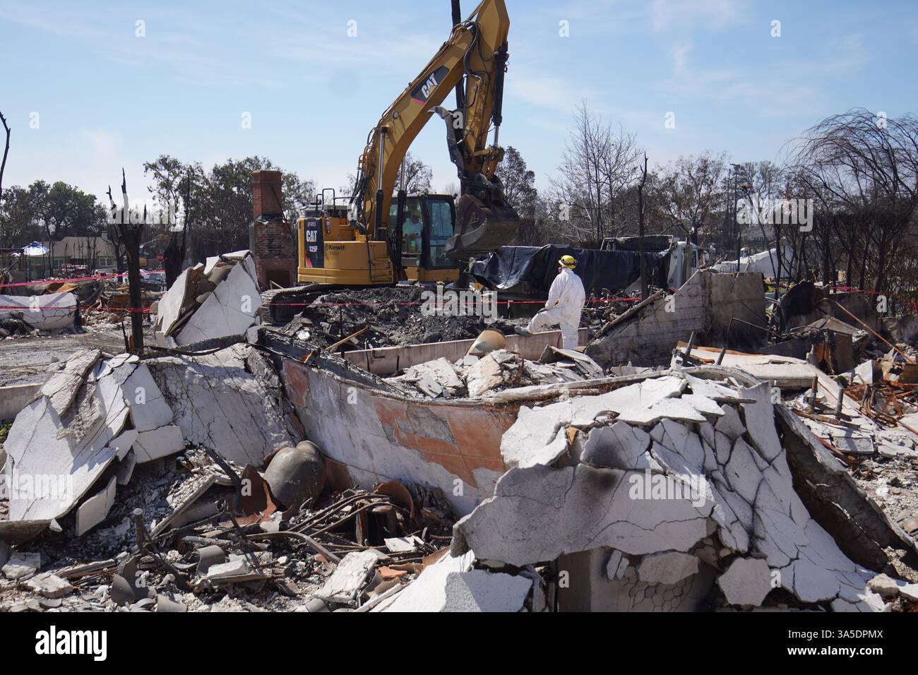 Workers help to remove the ash of the houses. Pacific Palisades was one ...
