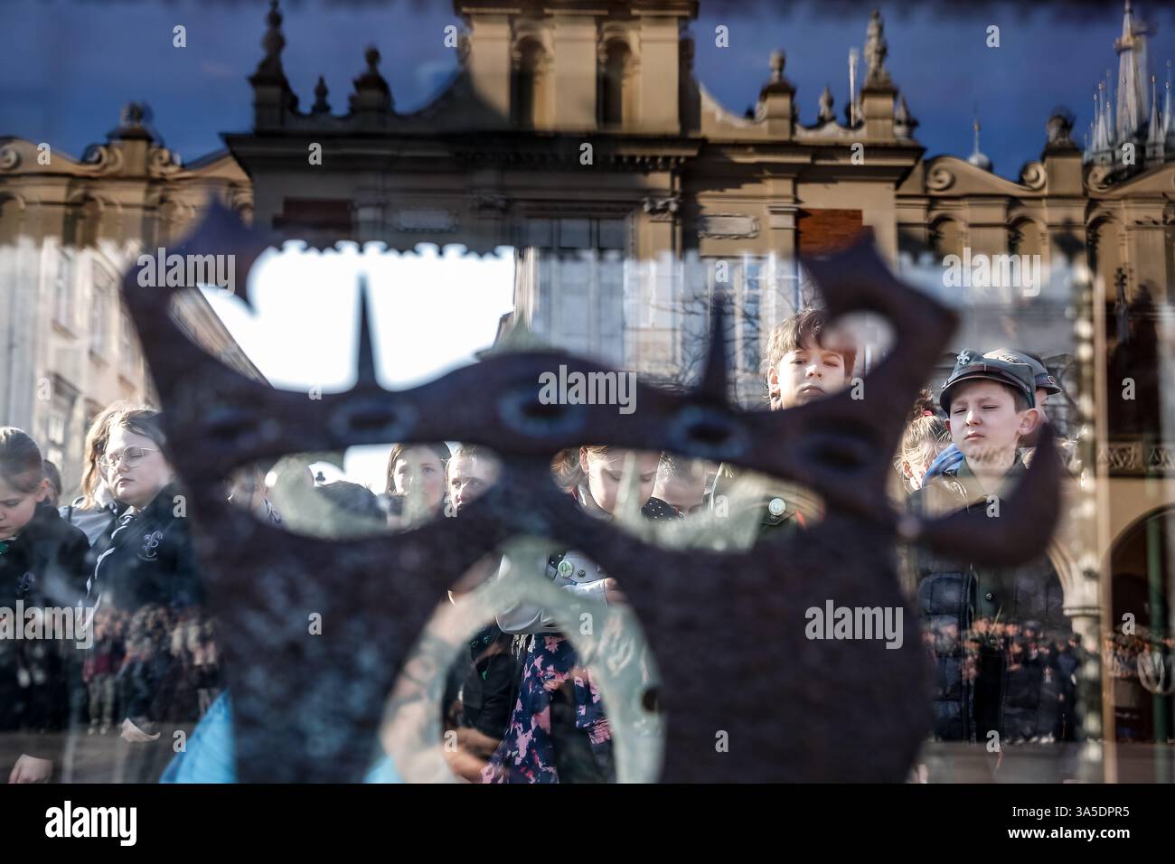 Guides and Scouts are photographed through a glass as they participate ...