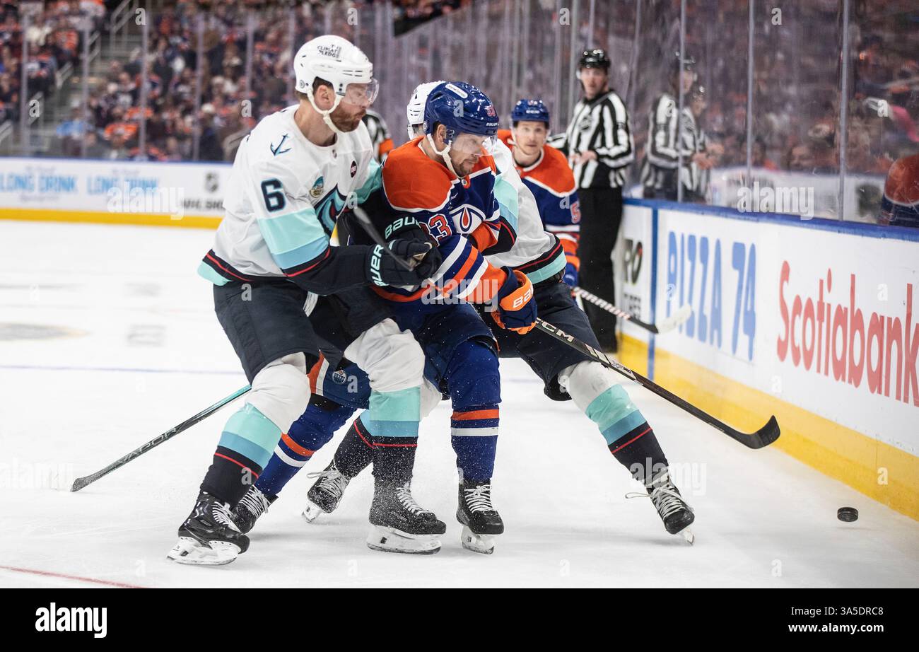 Seattle Kraken's Adam Larsson (6) and Matty Beniers (10) battle for the ...