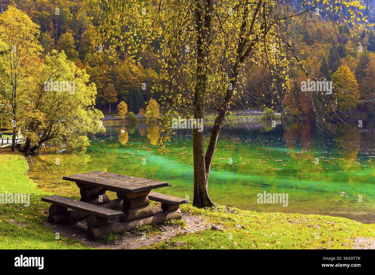 Alps, Northern Italy. Lake Fuzine. Cozy picnic corner - wooden table ...