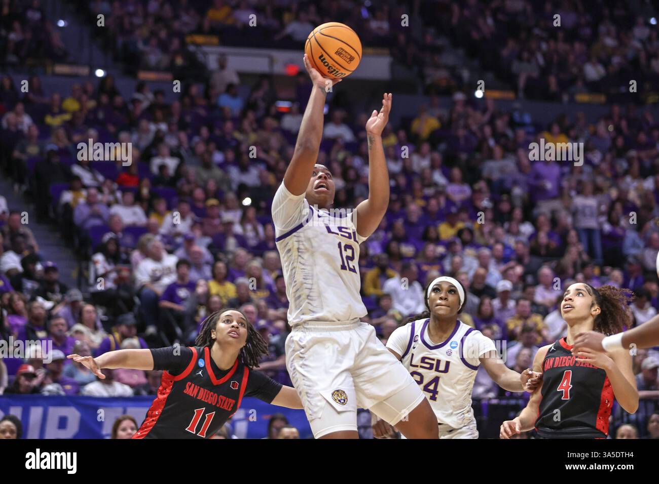 Baton Rouge, LA, USA. 22nd Mar, 2025. LSU's Mikaylah Williams (12) makes an off balanced shot ...