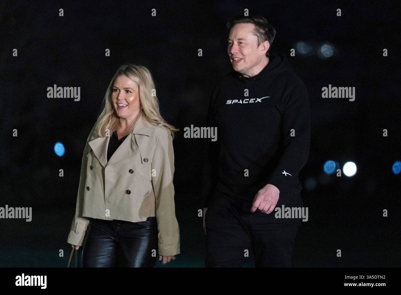 White House press secretary Karoline Leavitt and Elon Musk walk on the ...