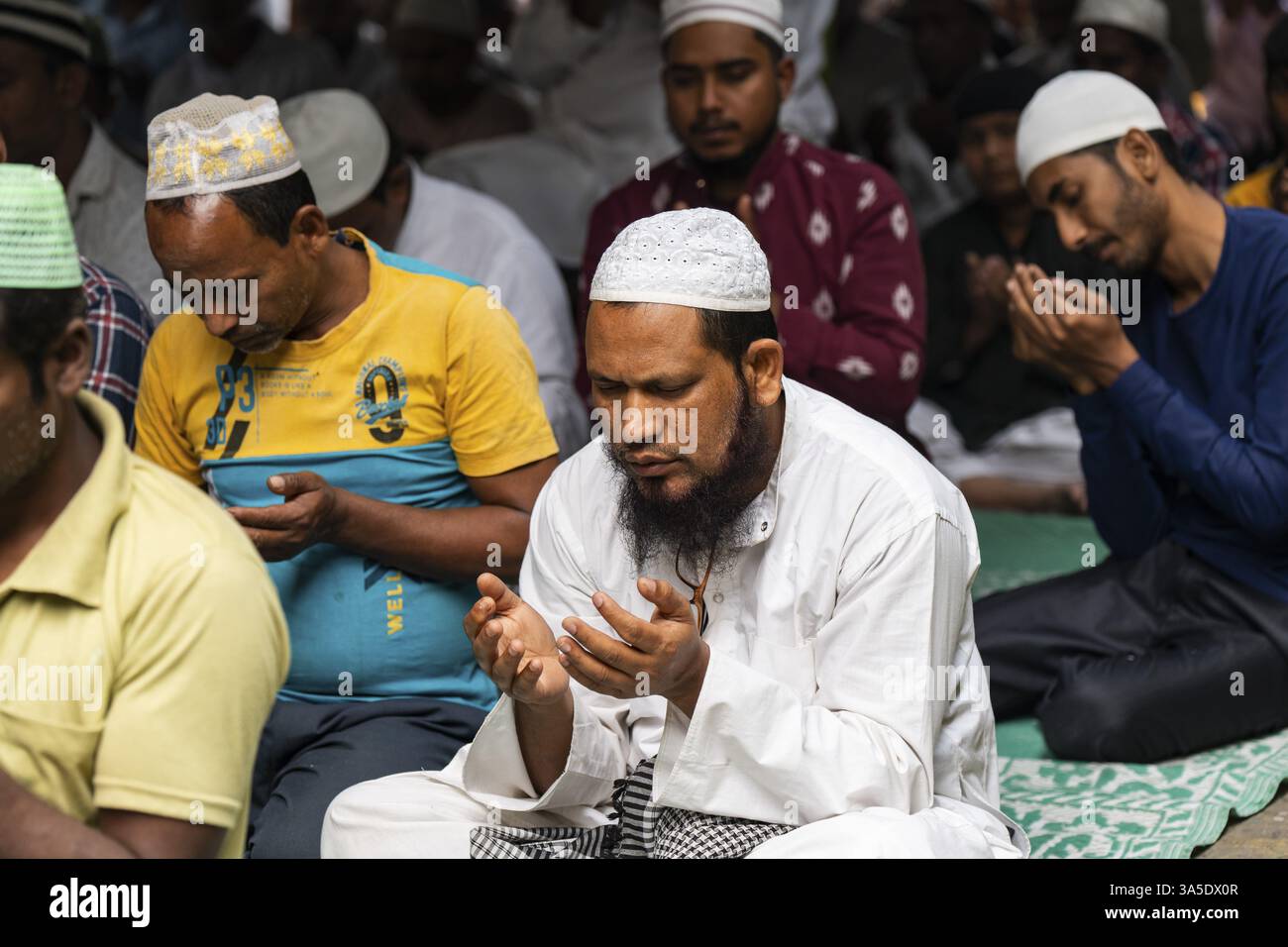 Muslims perform the Friday prayers at a Mosque in the holy month of ...