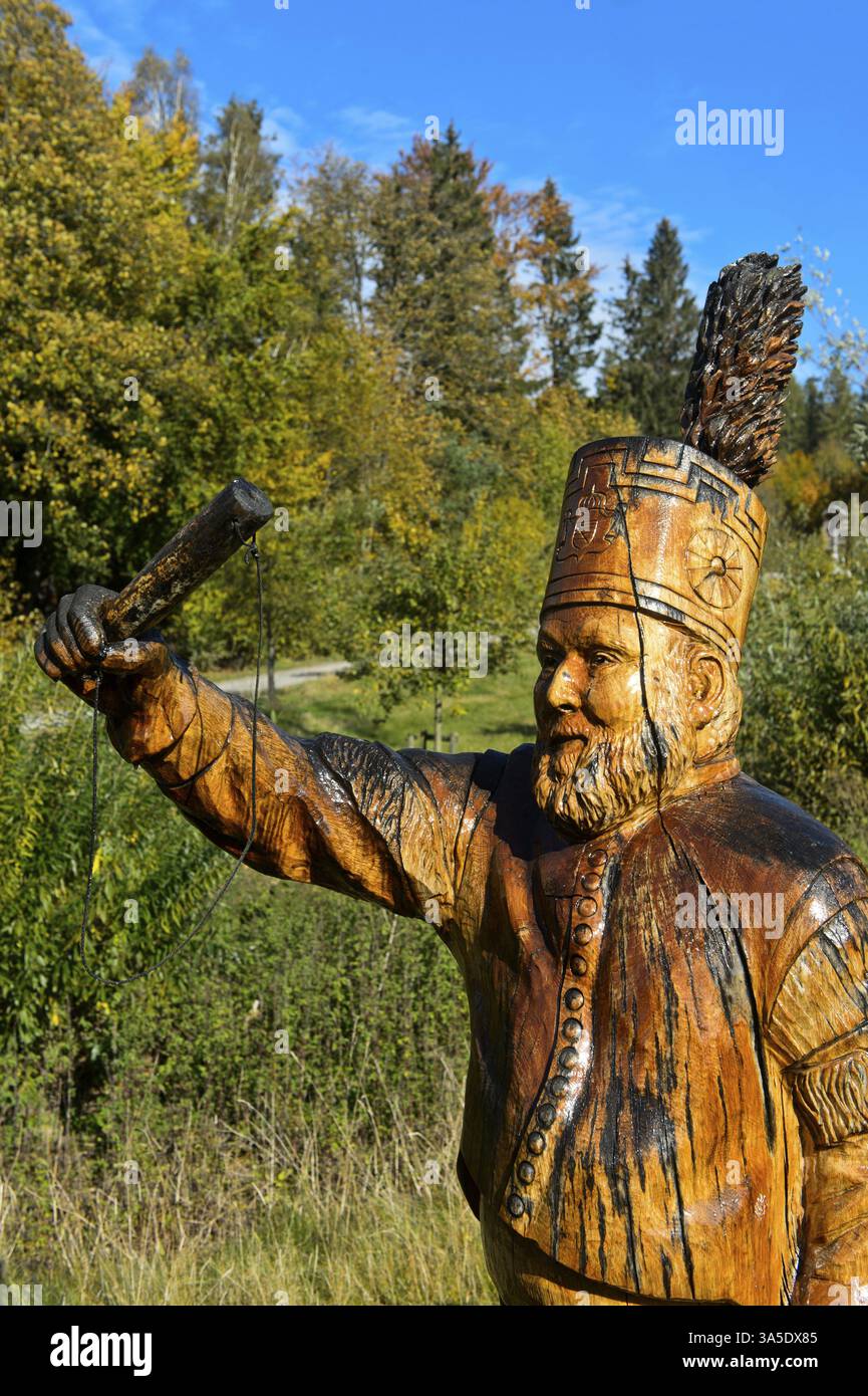 Traditional miner from the Ore Mountains, wooden sculptures of chainsaw ...