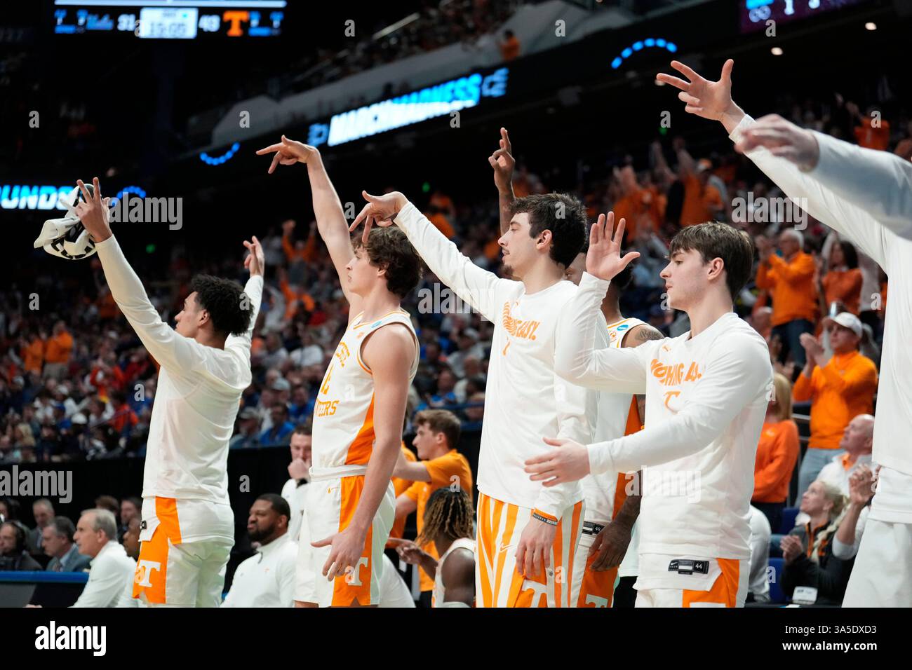 The Tennessee bench cheers for their teammates during the second half ...