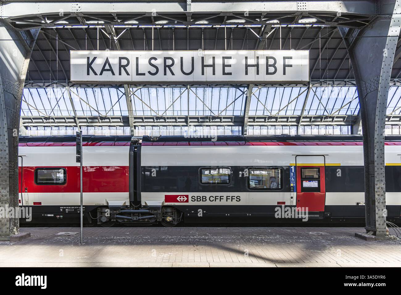 Karlsruhe main station with platform and station sign. InterCity of the ...