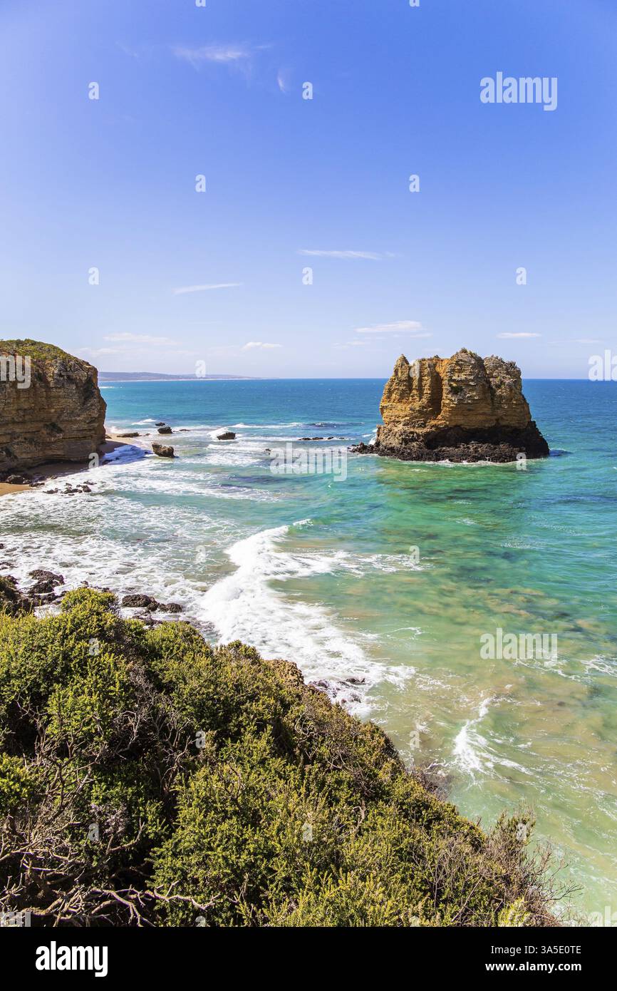 Coastal rocks in the foam of the ocean surf. Travel to the Southern ...