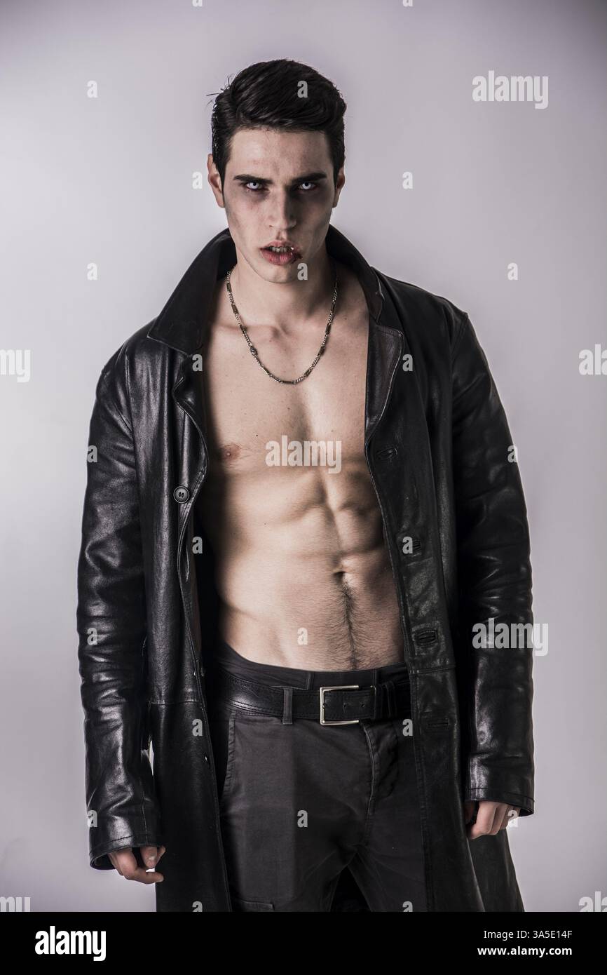 Portrait of a Young Vampire Man in an Open Black Leather Jacket ...