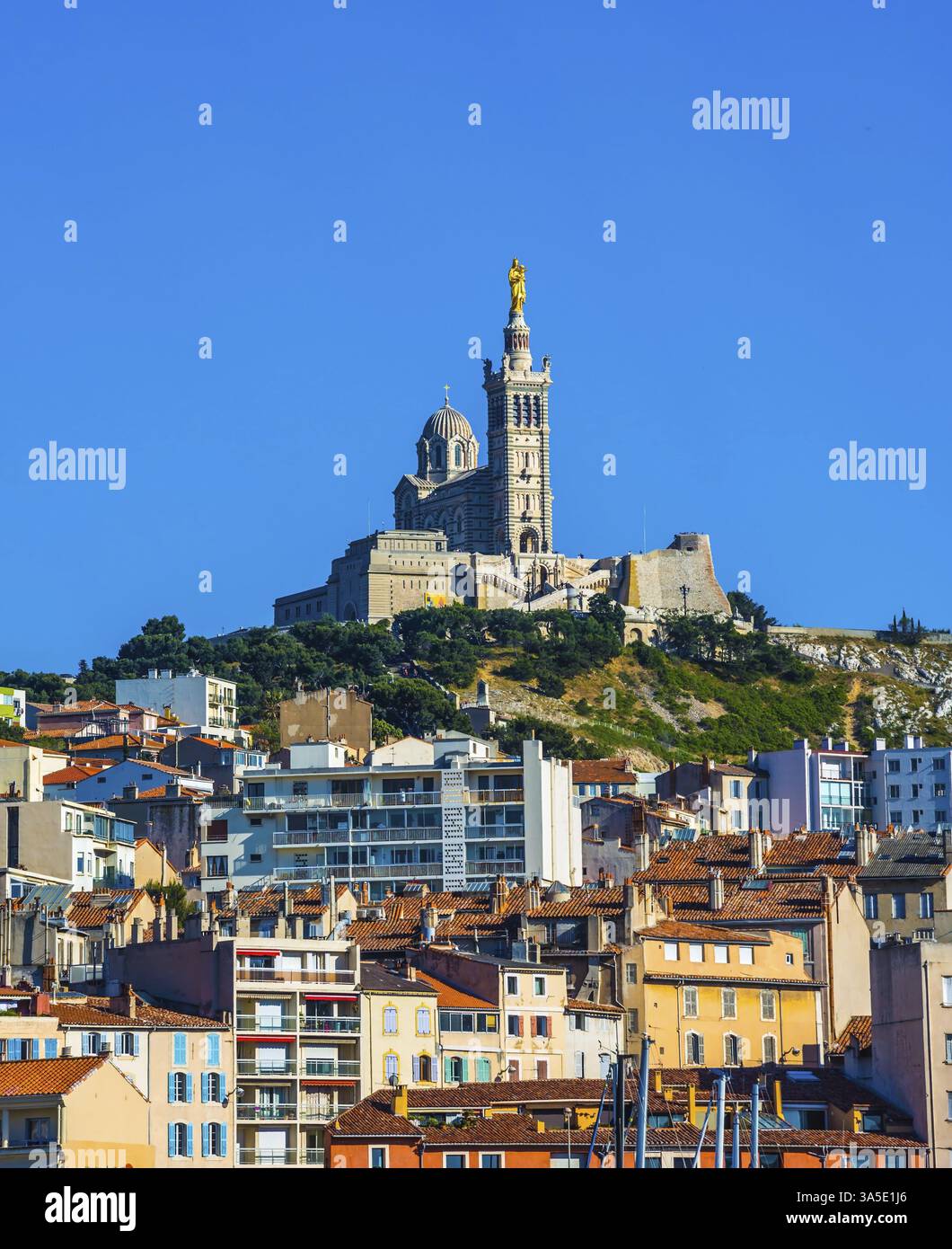 Marseilles in May. The Old Port and on the hill - splendid Basilica of ...