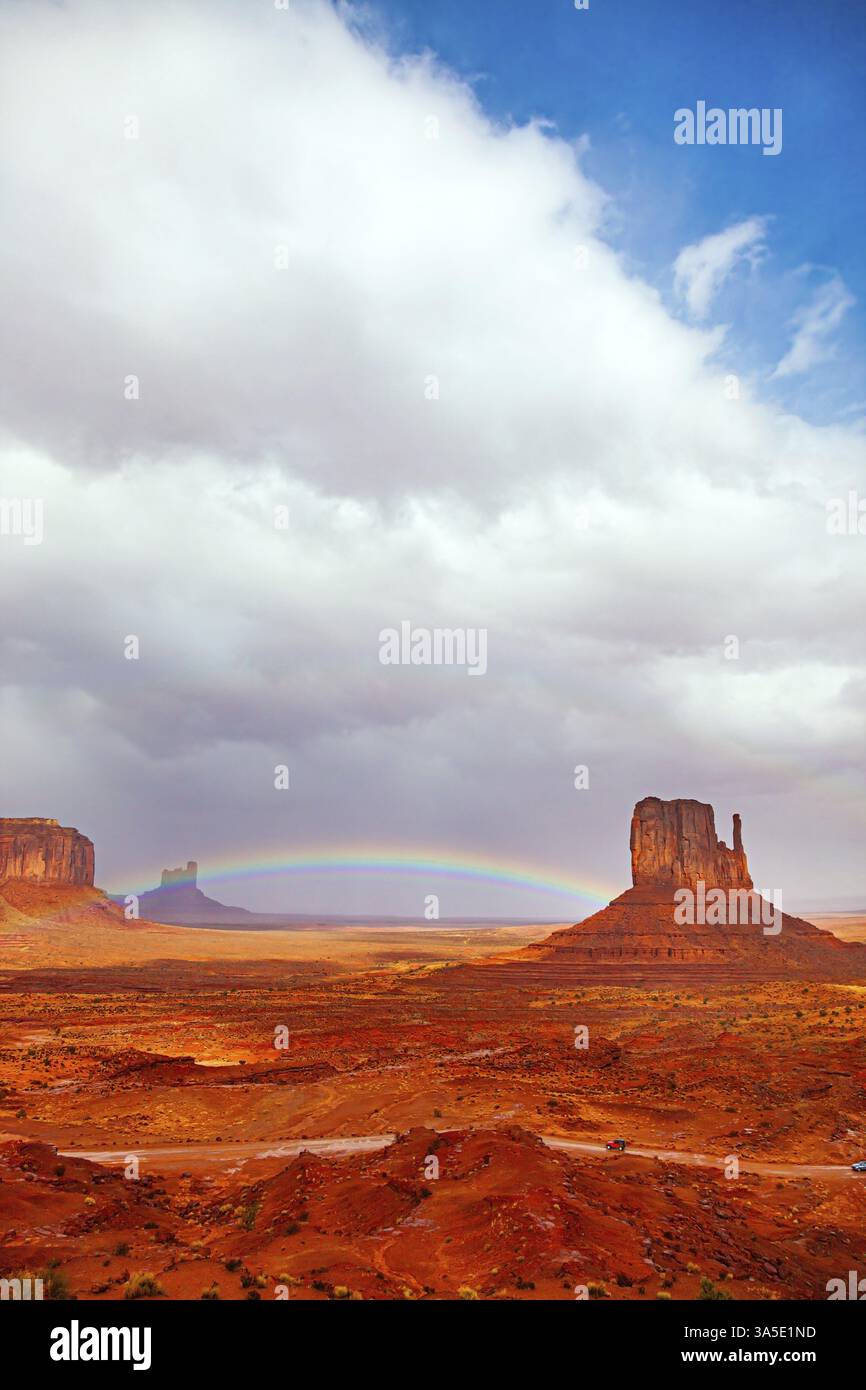The famous rock Mitten and the bright rainbow. USA. Navajo Indian ...