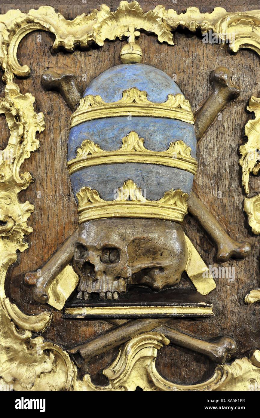 Symbolic representation of a skull with a papal crown and crossed bones ...