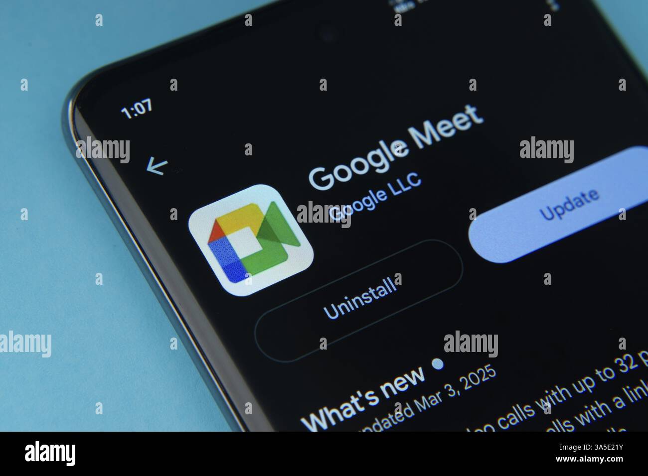 The Google Meet app from Google Playstore is displayed on a smartphone ...