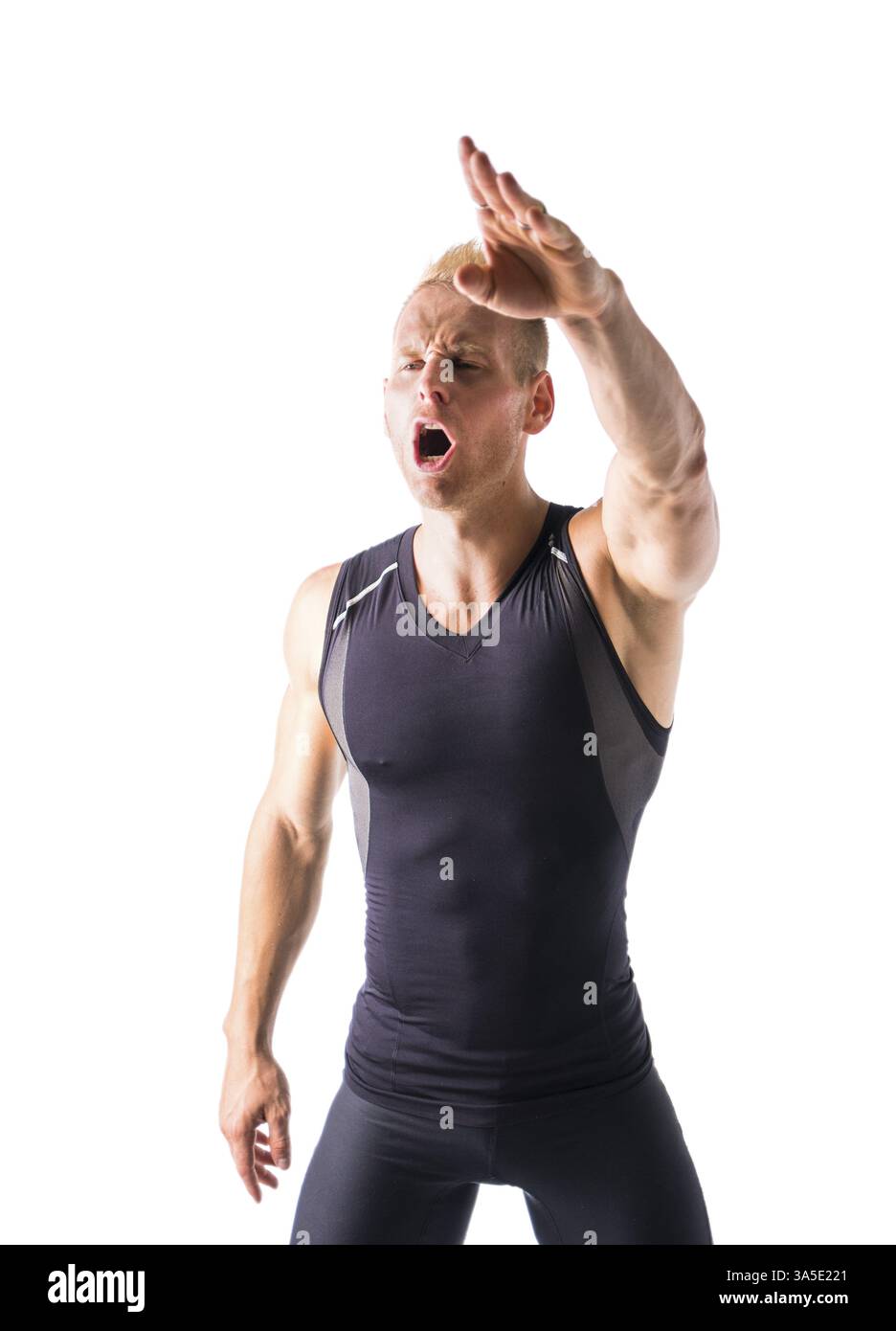 Muscular young blond man holding a hand up and yelling isolated on ...