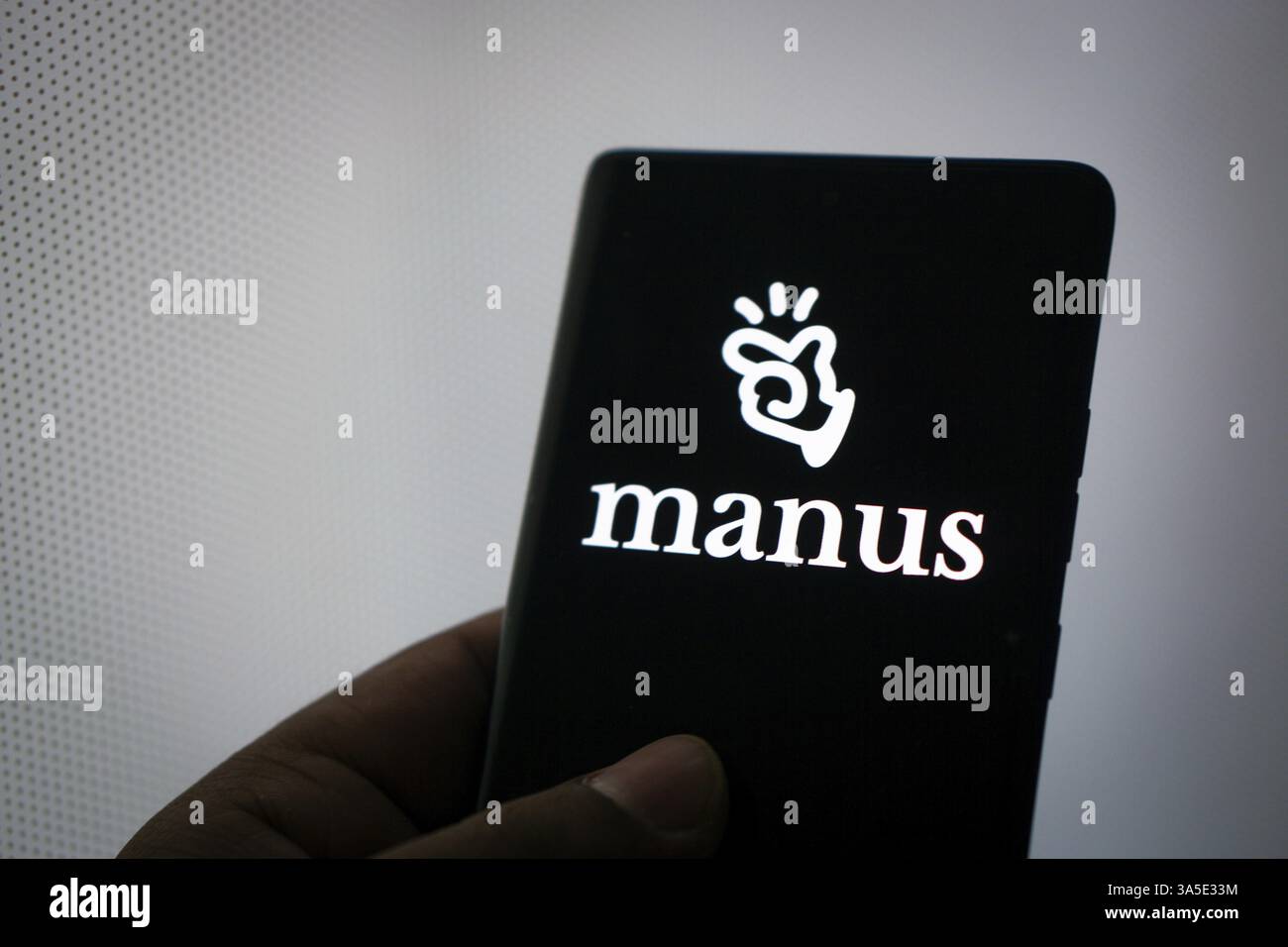 Close up of Manus logo on screen of mobile phone Stock Photo - Alamy