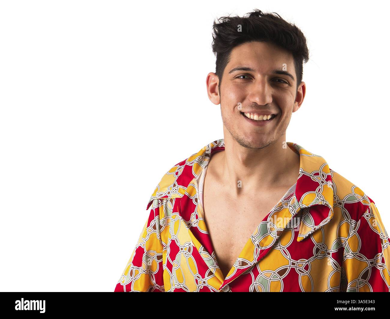 Young man in stylish colorful 60's, hippie outfit on white background ...