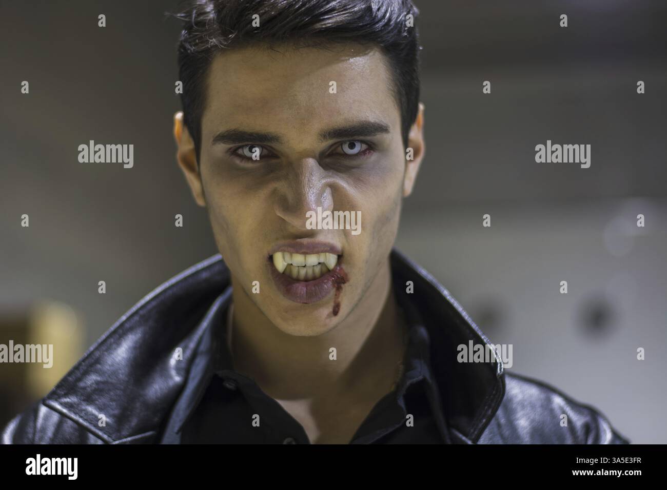 Close up Face of a Handsome Vampire Man in Leather Clothing, with Blood ...
