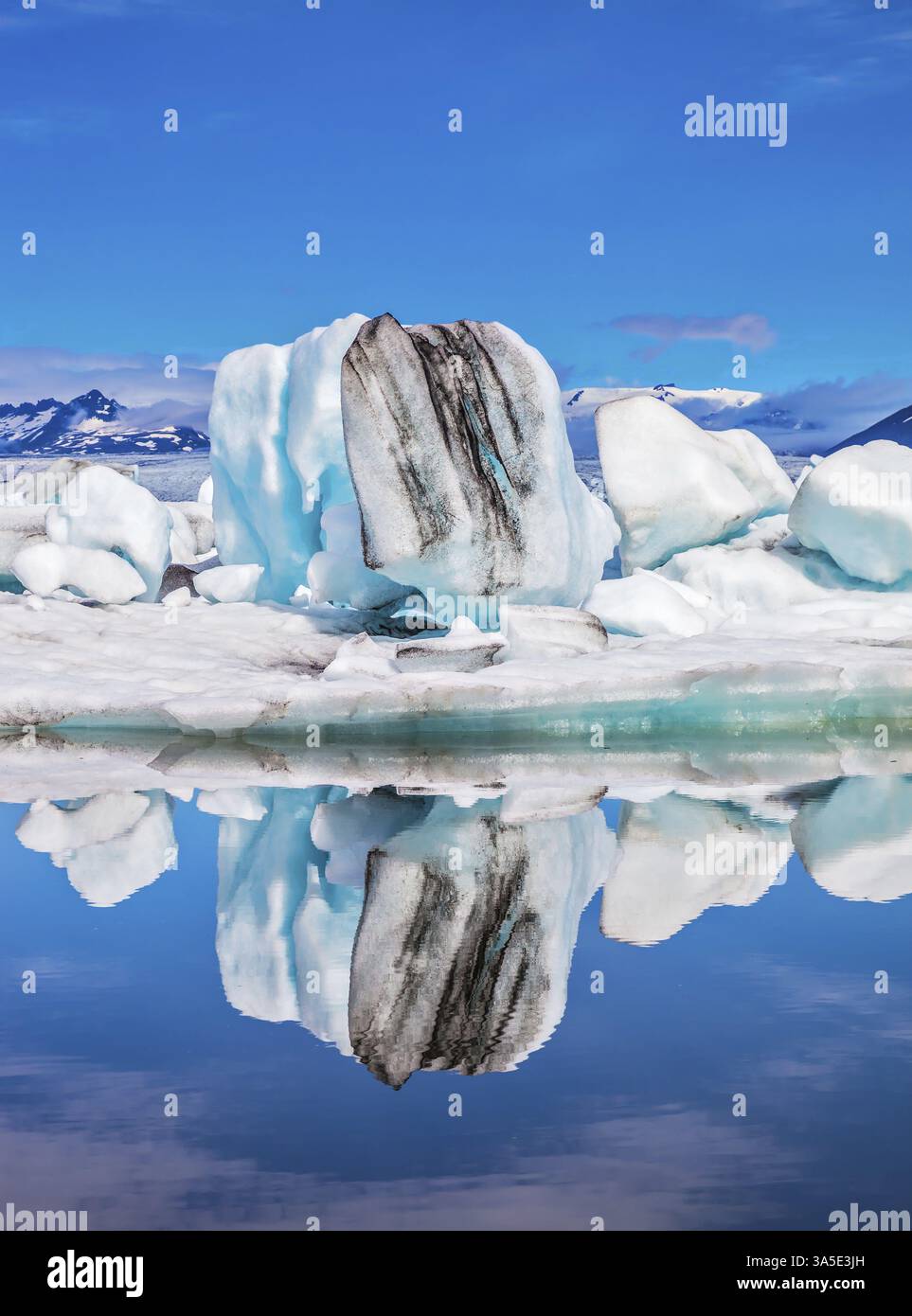 Ice lagoon in July. Ice floes and icebergs are reflected in the ...