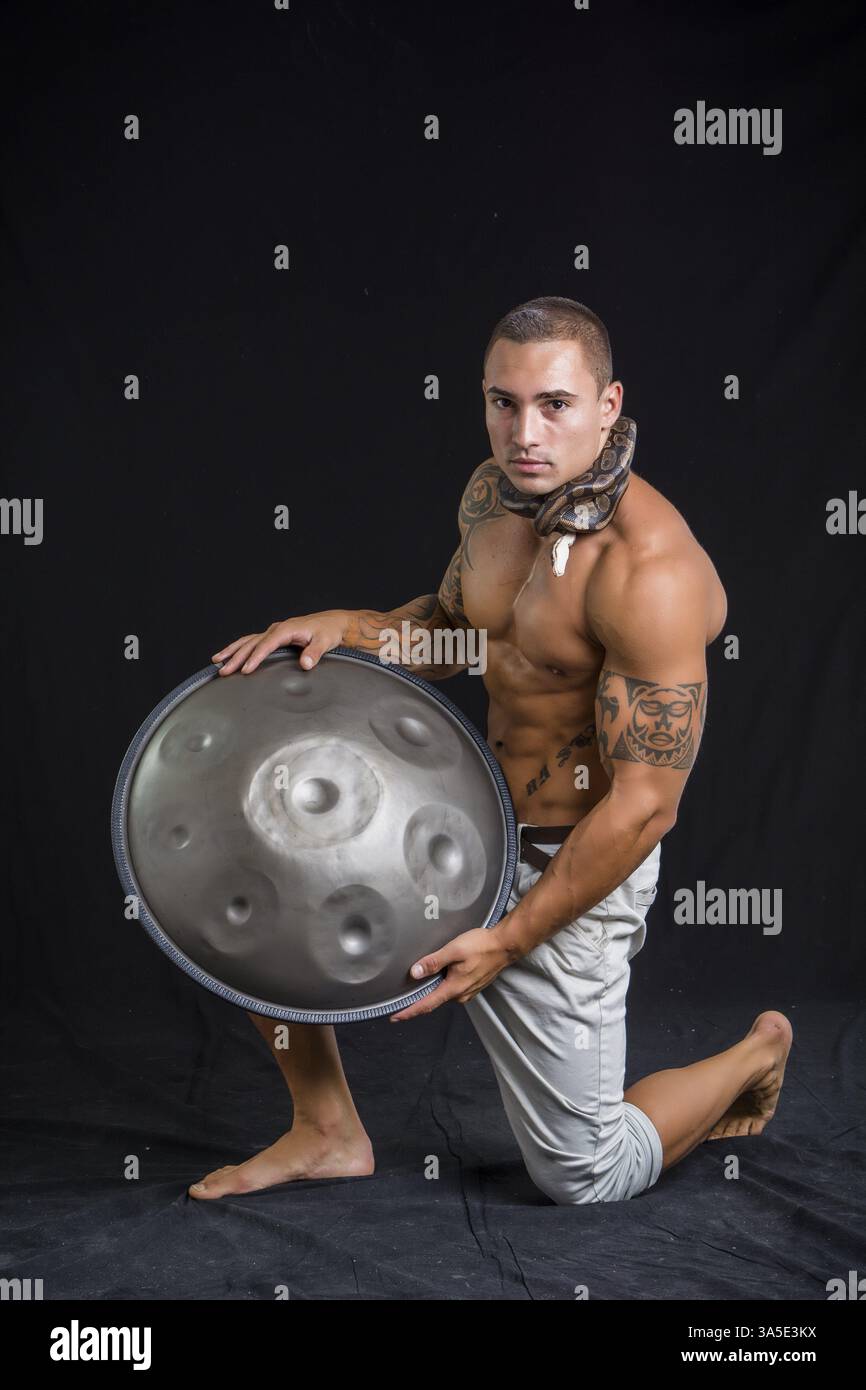 Exotic Male Drummer Drumming with Hands on Steel Pan Drums, While ...