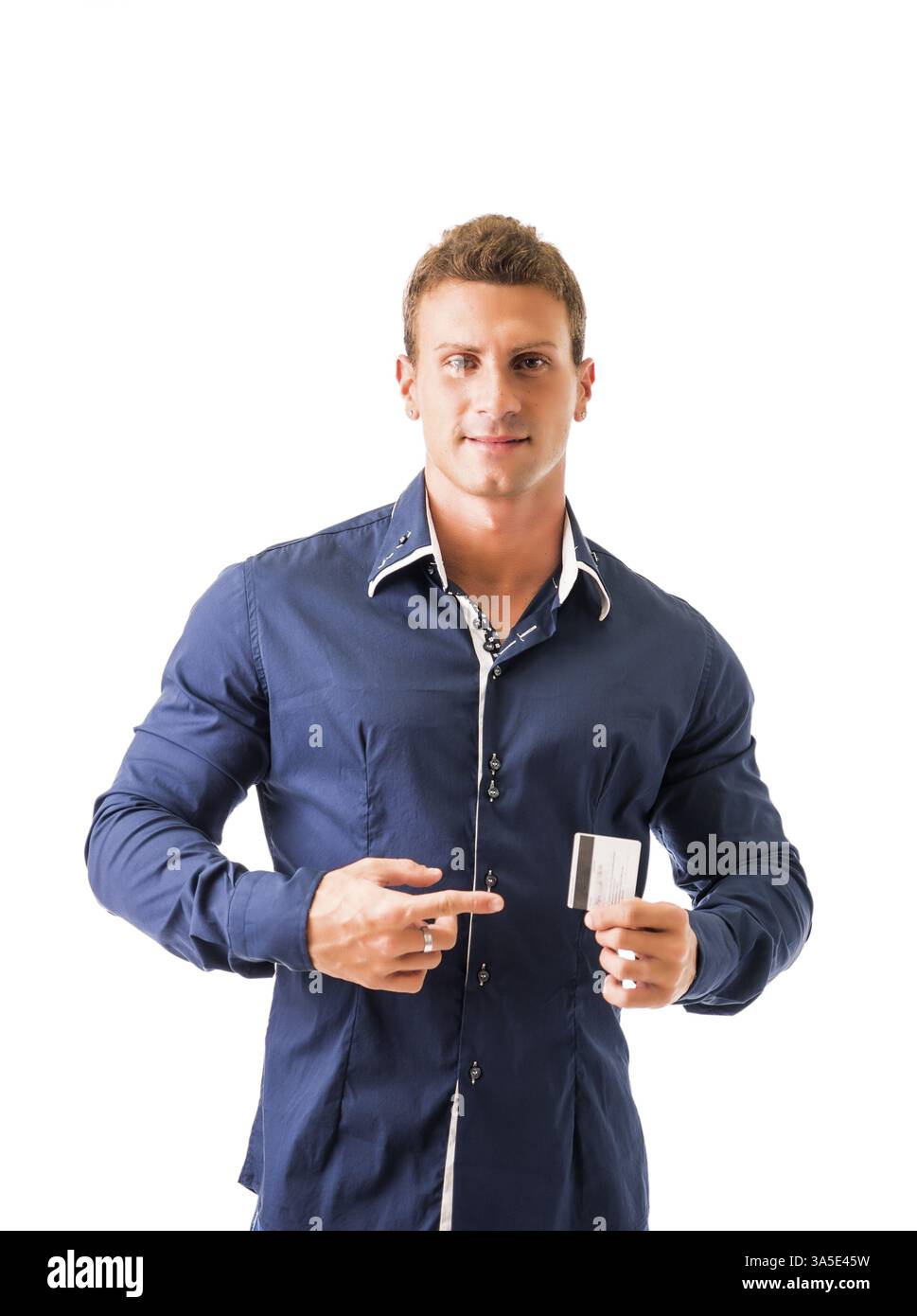 Attractive young man holding credit card, isolated on white background ...