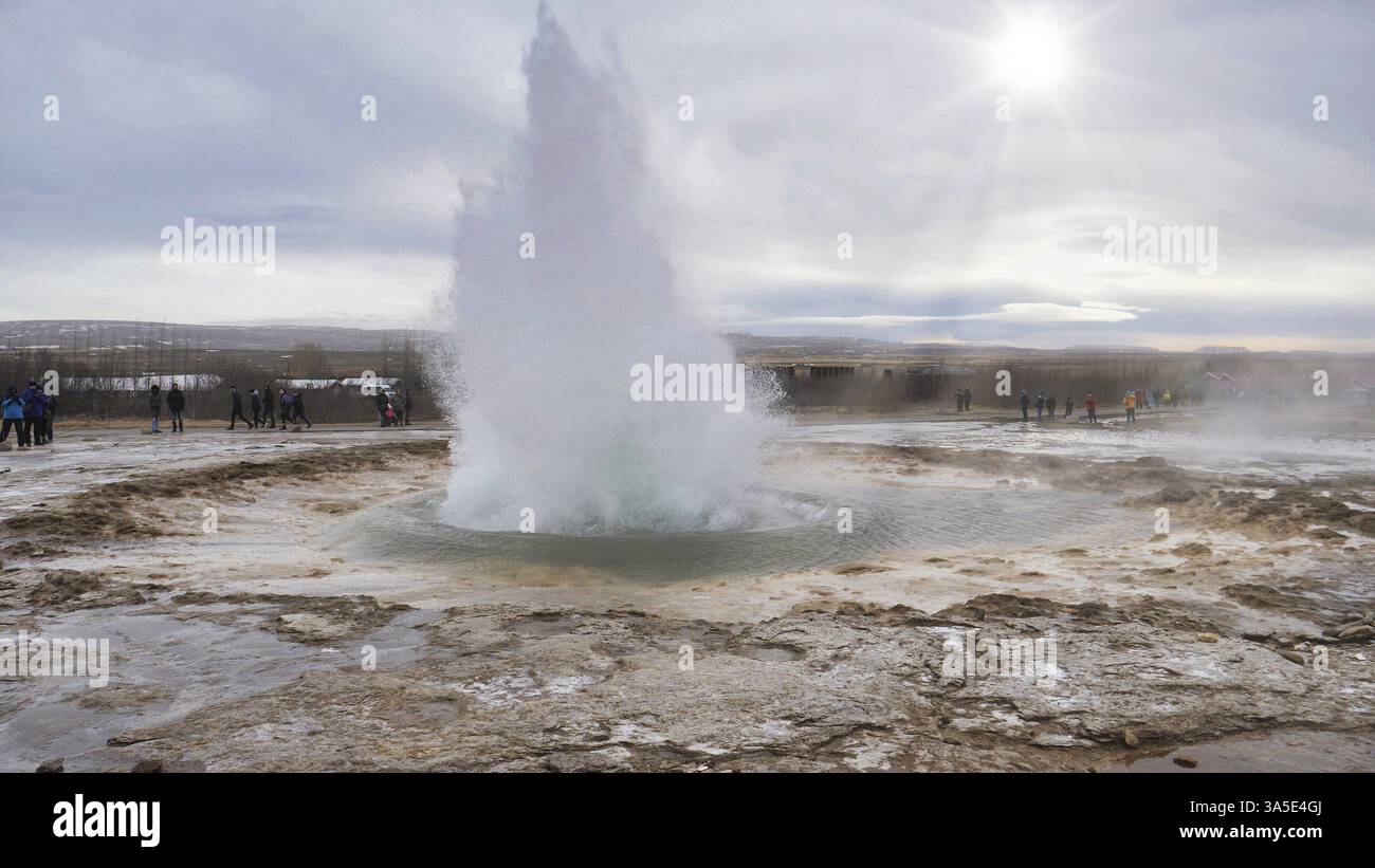Geyser erupting in Iceland, producing big splash of hot water and steam ...