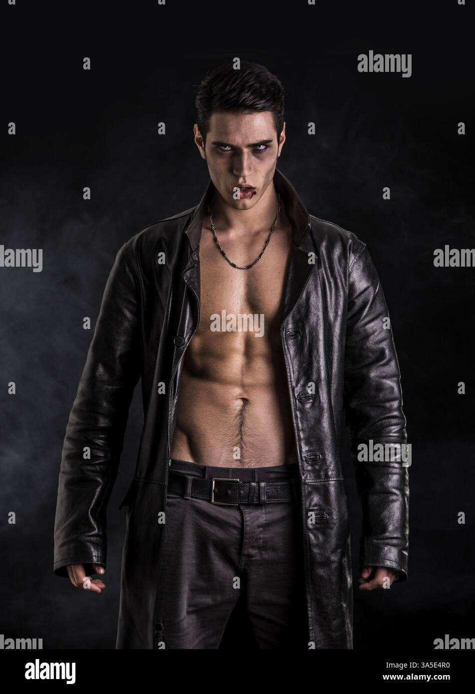 Portrait of a Young Vampire Man in an Open Black Leather Jacket ...