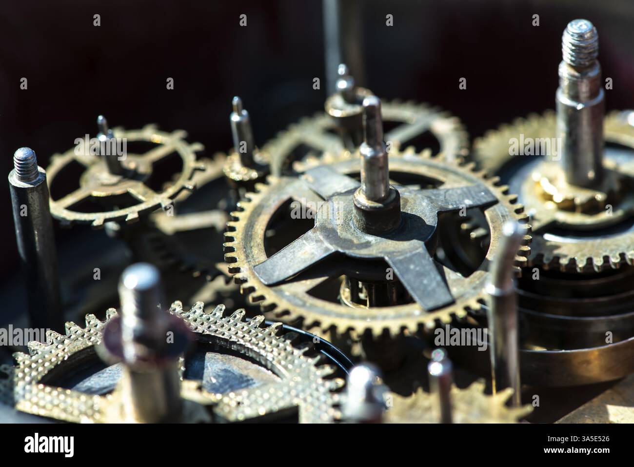 Close up metal gears mechanism. Golden colours. Hard light. Clock ...