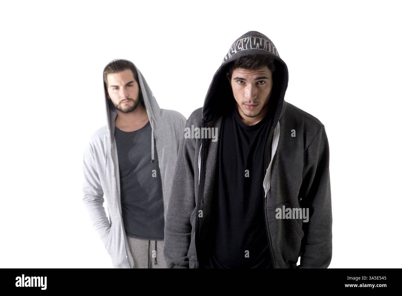 Two seemingly dangerous thugs standing next to each other in front of a ...