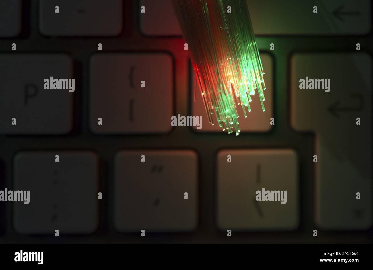 Colourful optic fibers illuminated on keyboard. High speed internet ...