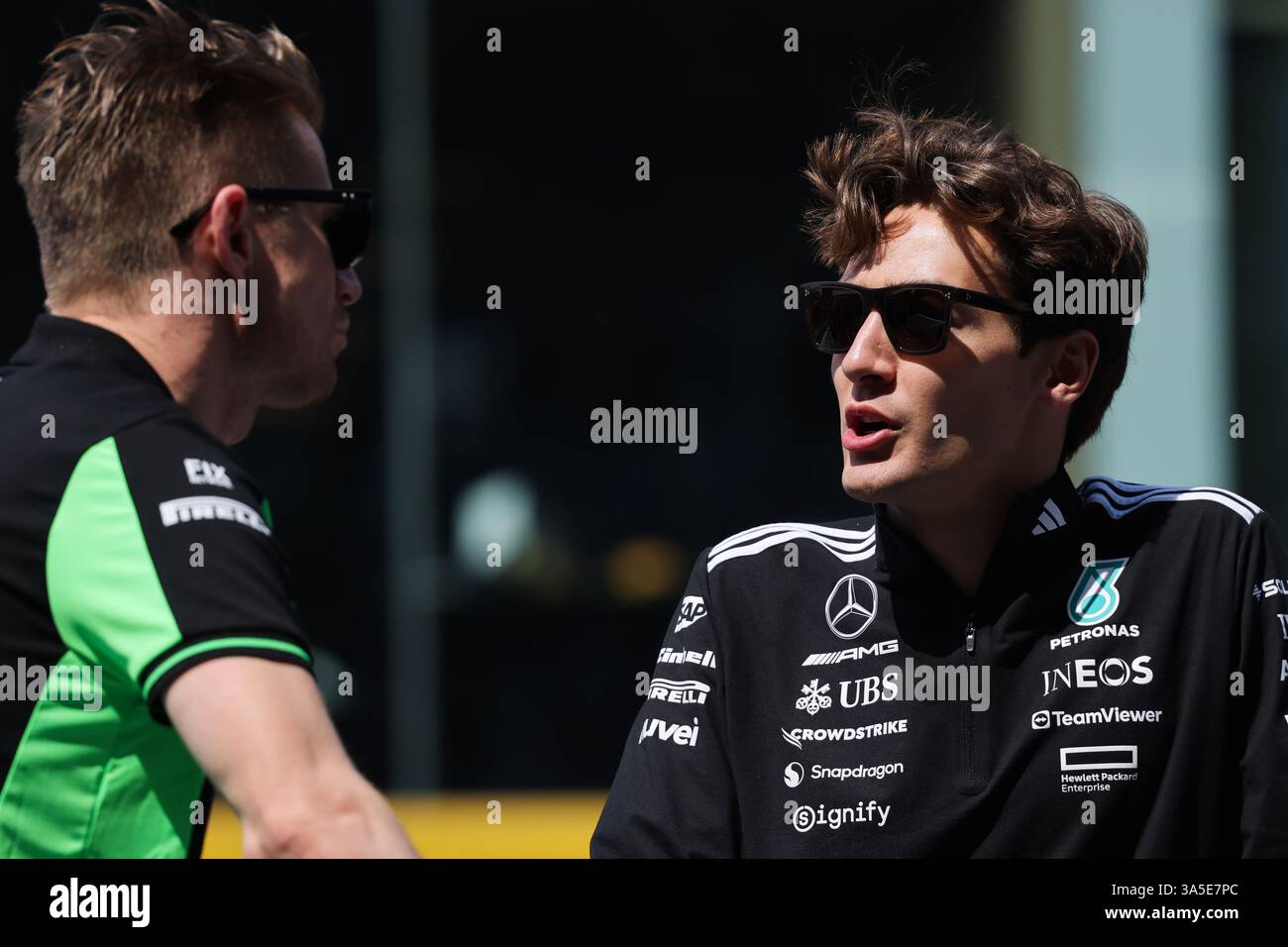 (L to R): Nico Hulkenberg (GER) Sauber with George Russell (GBR ...