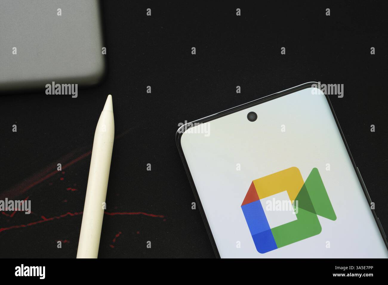 The logo of the Google Meet is displayed on a smartphone screen Stock ...