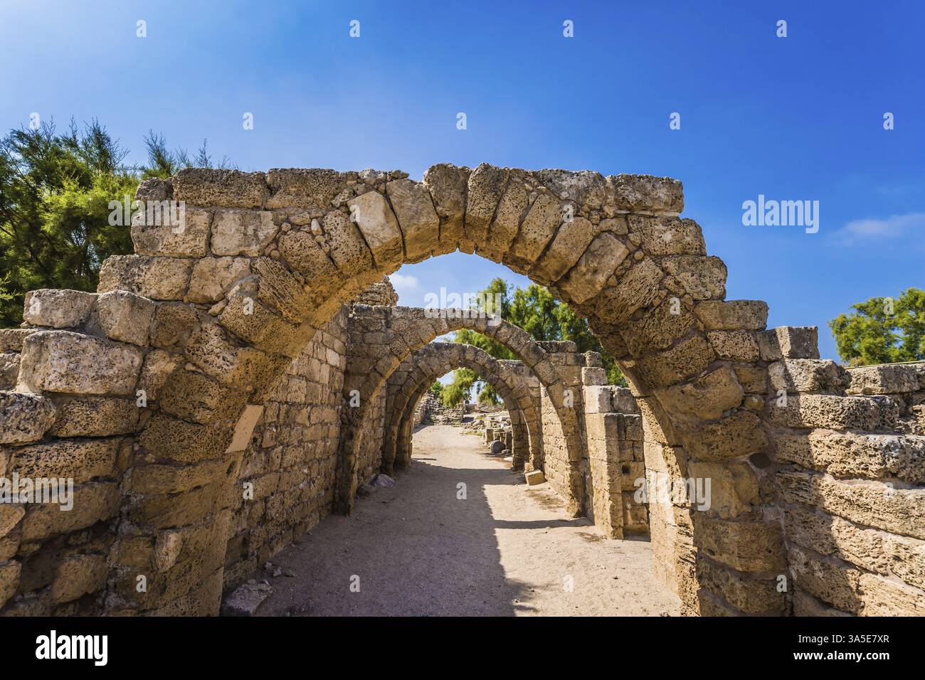 Picturesque ruins of the ancient seaport Caesarea. Sunny spring day ...