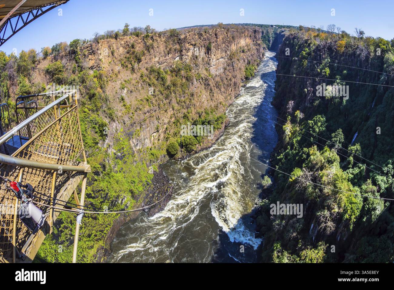 The famous Victoria Falls in Zambia. Bungee jumping from a bridge near ...