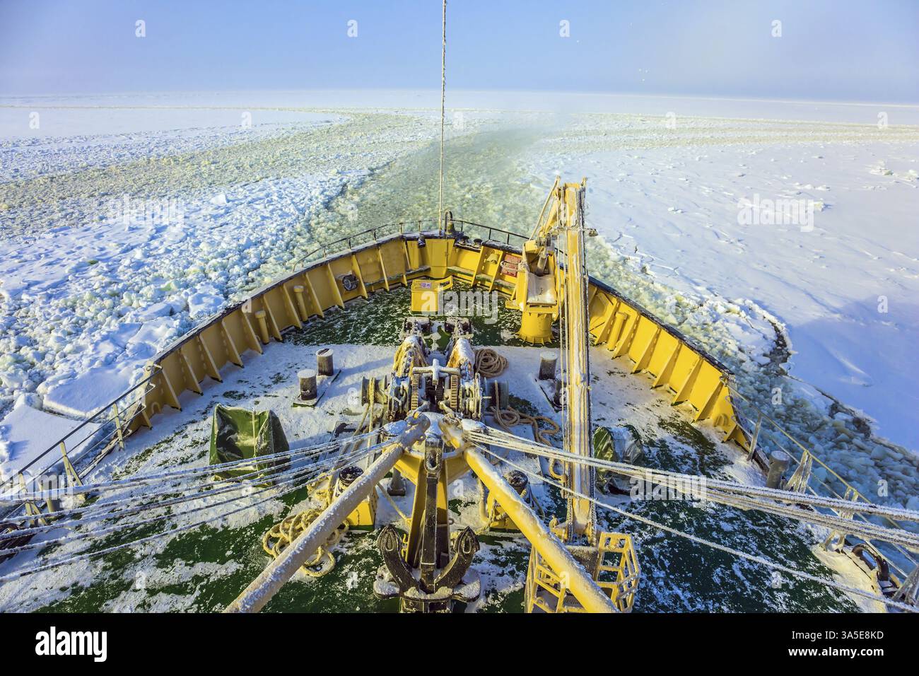 Lapland. Wide strip of ice crumb spreads behind the icebreaker ...