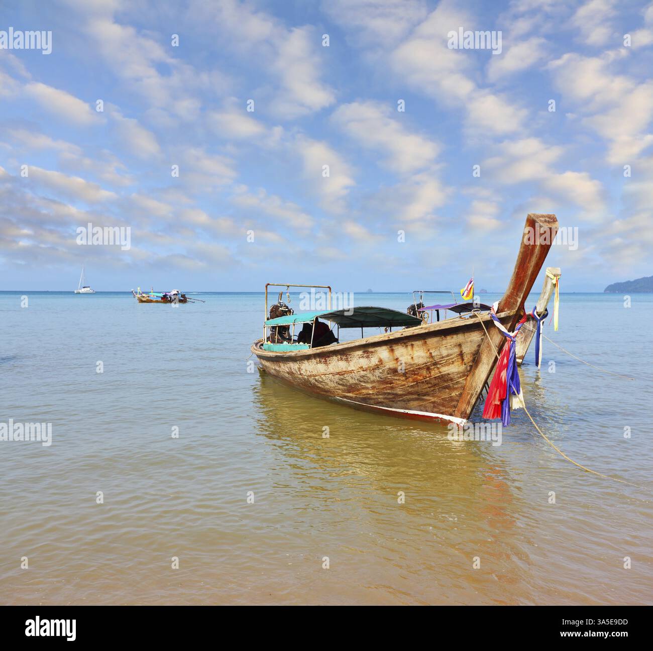 Fantastic coast in the southern seas. Easy native boat Longtail has ...