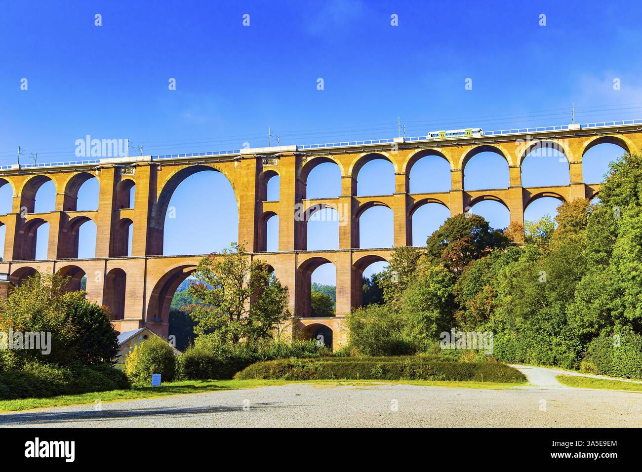 The train passes over the bridge. The Goltzsch Viaduct is the world's ...