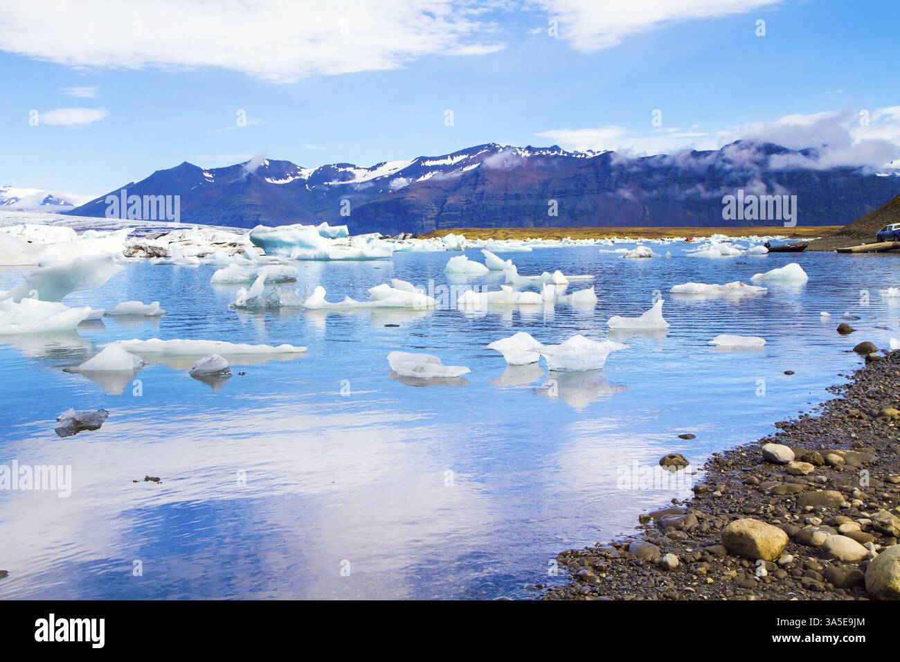 Cold, clear July day. The lagoon Jokulsarlon. Iceland. Bizarre icebergs ...