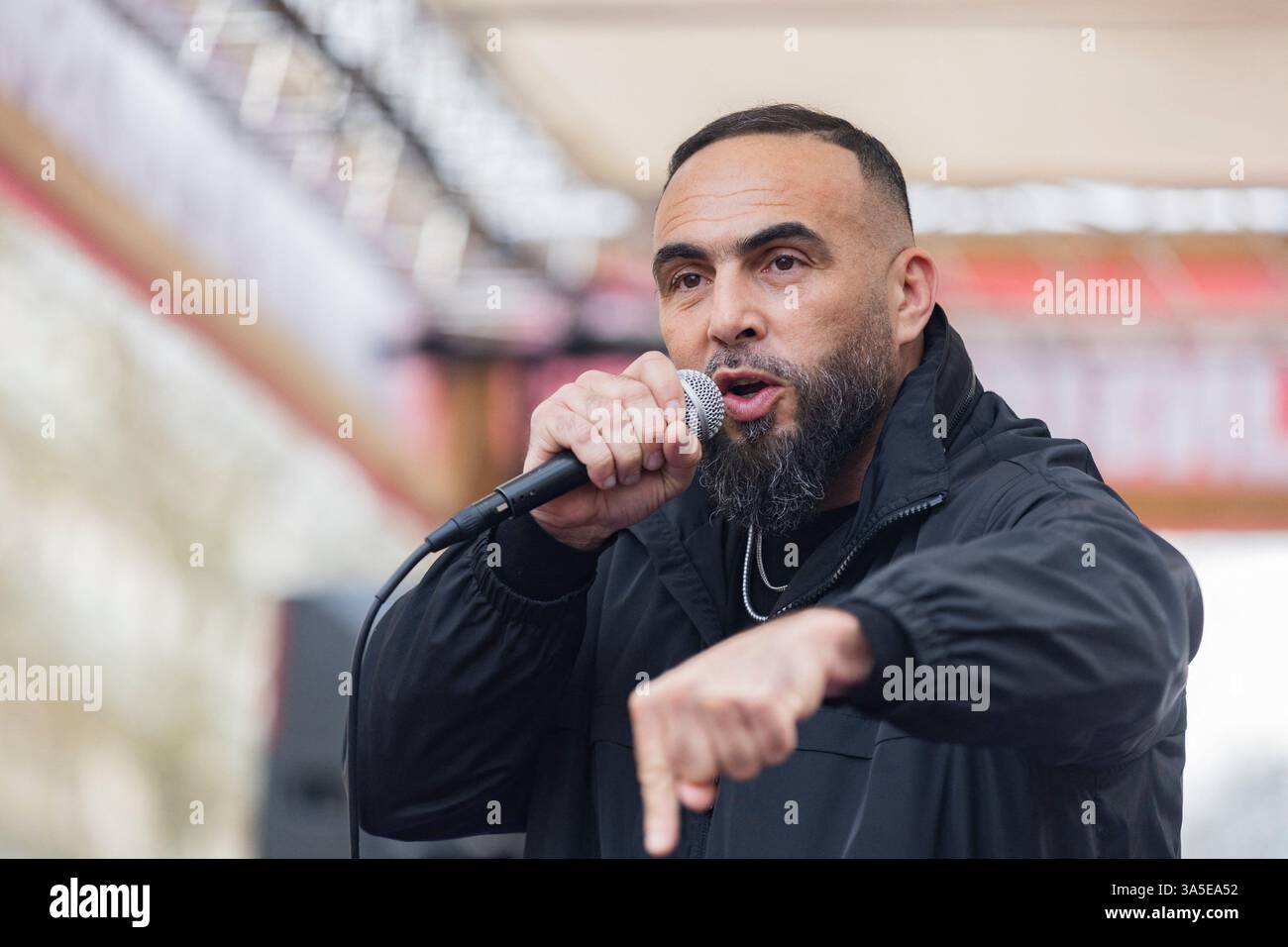 French rapper Medine speaks to the crowd at the march against racism ...