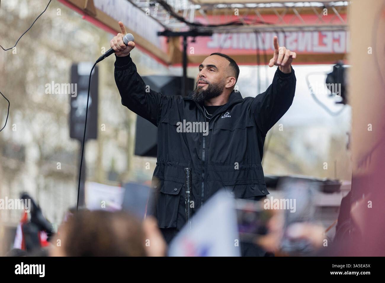 French rapper Medine speaks to the crowd at the march against racism ...