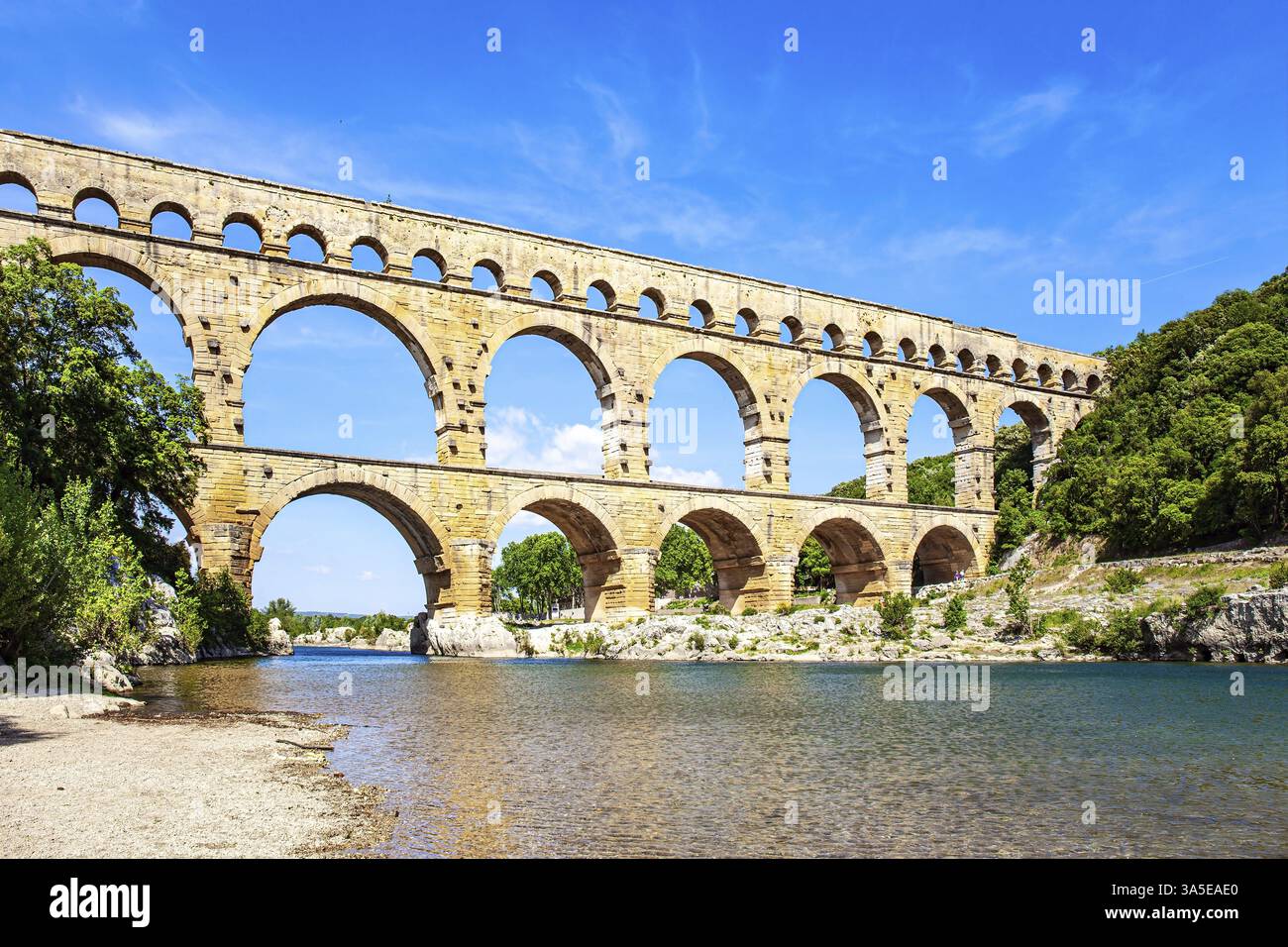 The shallow Gardon River. The Pont du Gard is the tallest Roman ...