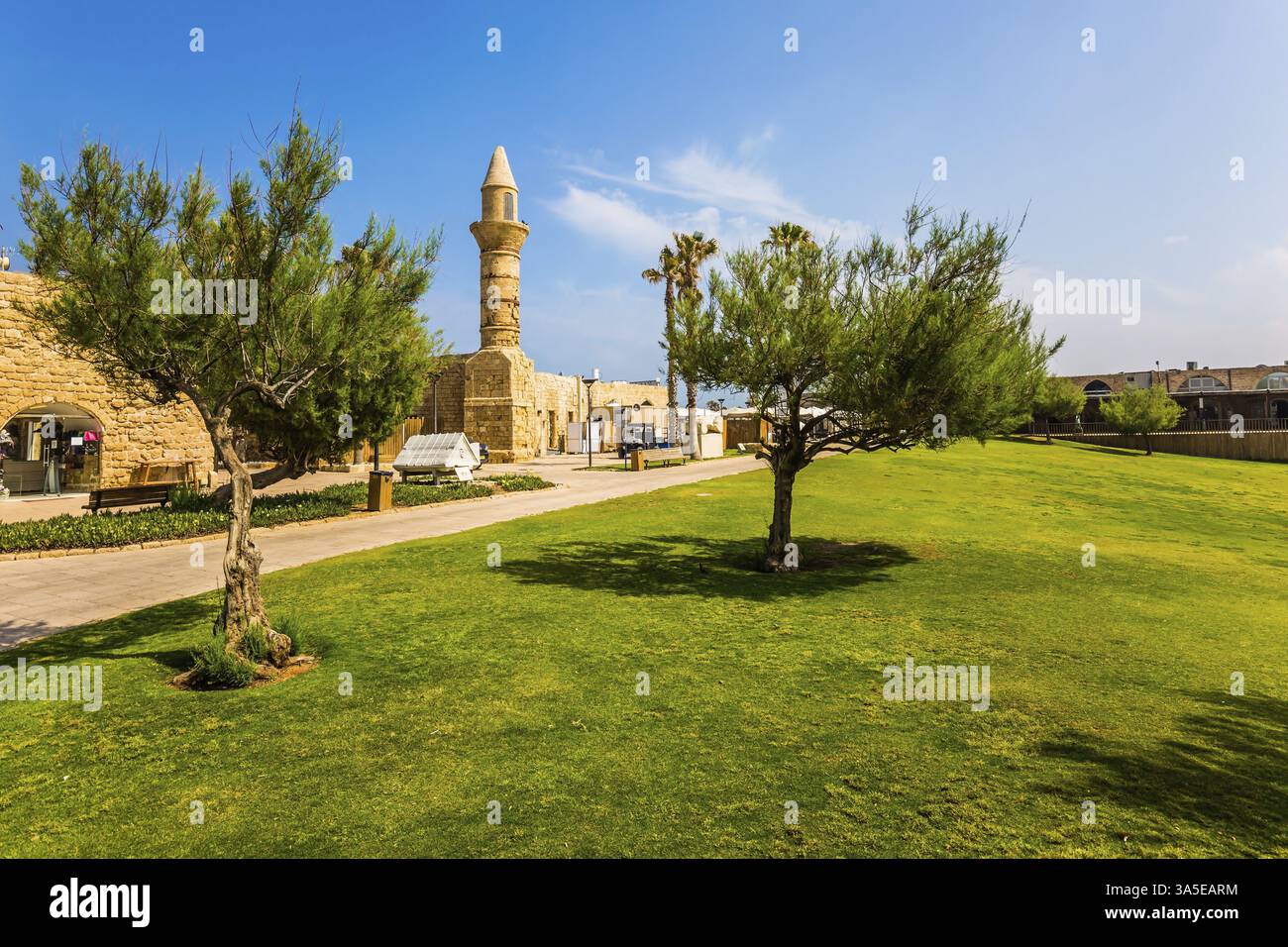 Israel. Ruins of the ancient port of Caesarea. The restored minaret is ...