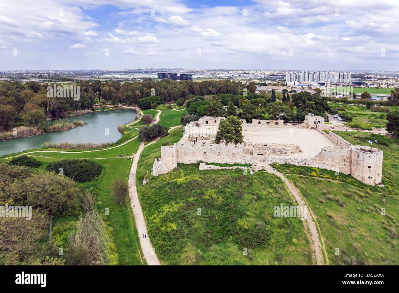 The walls of the Tel Afek fortress. The picturesque lake brings ...