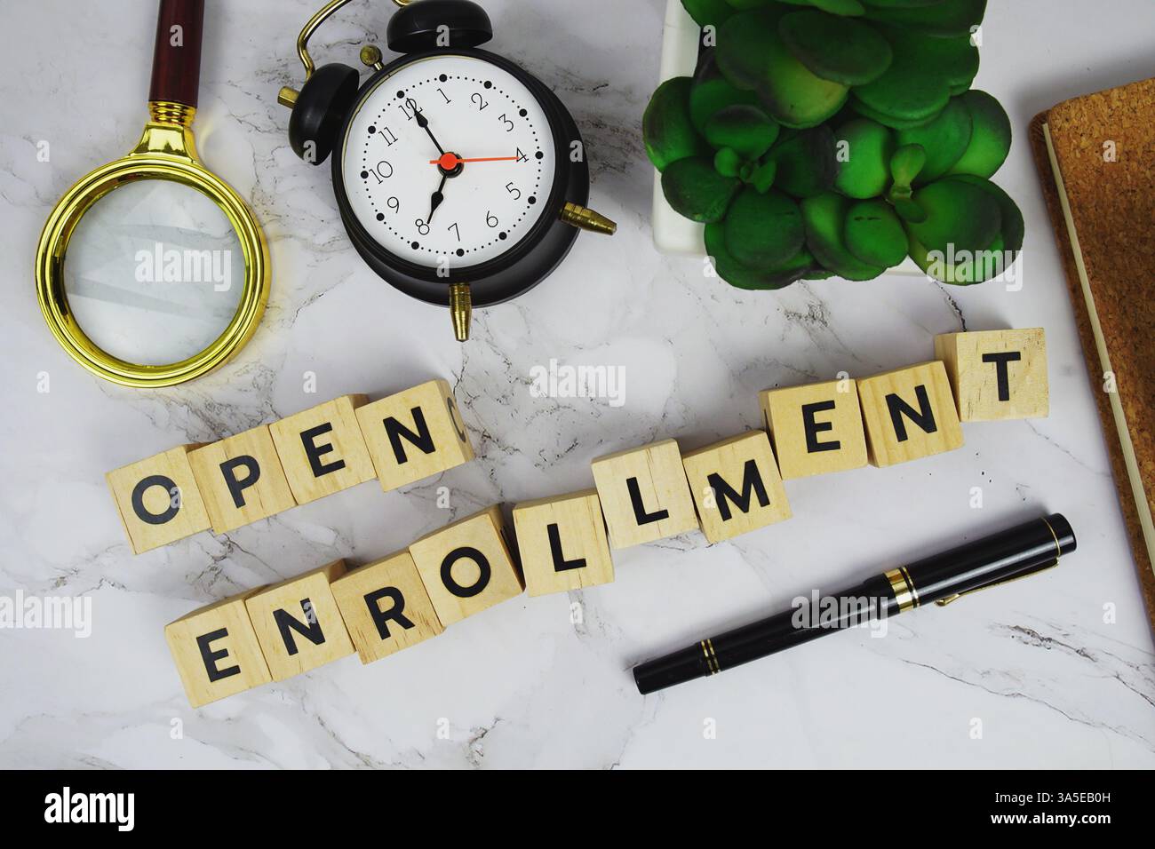 Open Enrollment with wooden blocks alphabet letters and Magnifying ...