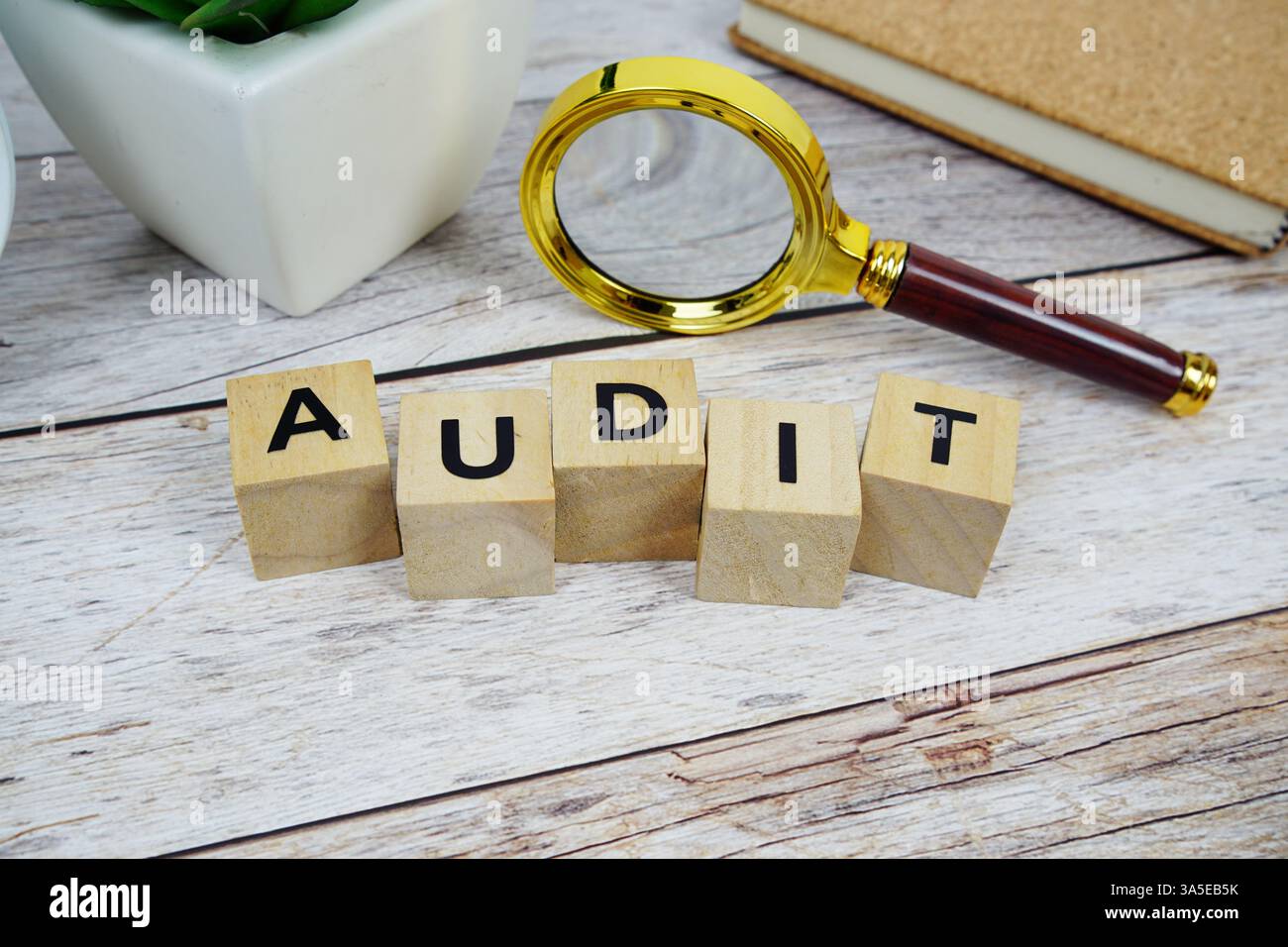 Magnifying Glass With Wooden Blocks Alphabet Letters Audit Text Message On Wooden Background