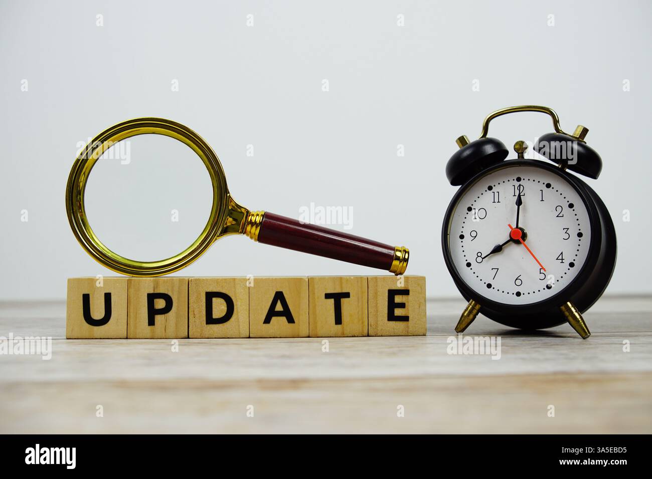 Time to Update with wooden blocks alphabet letters and Magnifying glass ...