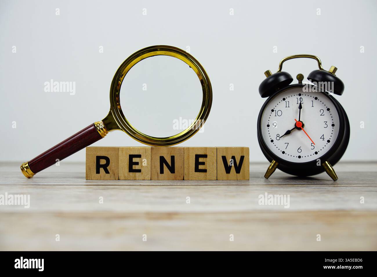 Time to Renew with wooden blocks alphabet letters and Magnifying glass ...
