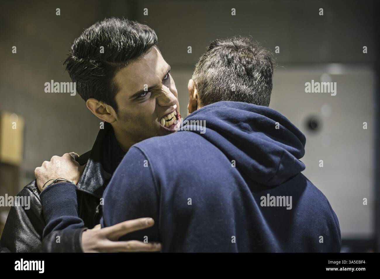 Close up Hungry Young Male Vampire with Scary Facial Expression Bites ...